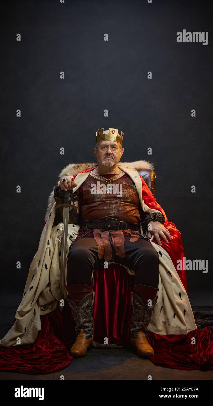 Medieval man, king sitting on throne in crown, in full regal attire and ...
