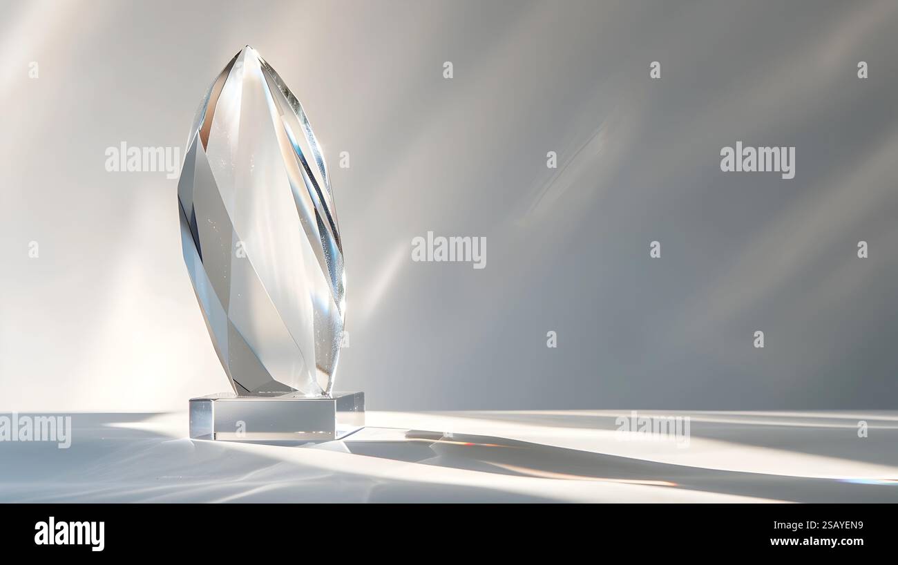 A crystal clear,elegant trophy stands proudly on a pristine white background,its smooth ...