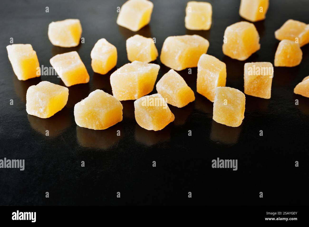 Traditional candies of candied ginger root , yellow spicy taste bonbon ...