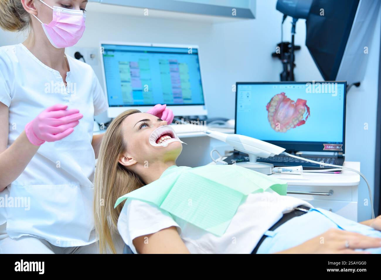 Dentist and patient are sitting in the office before the procedure of ...