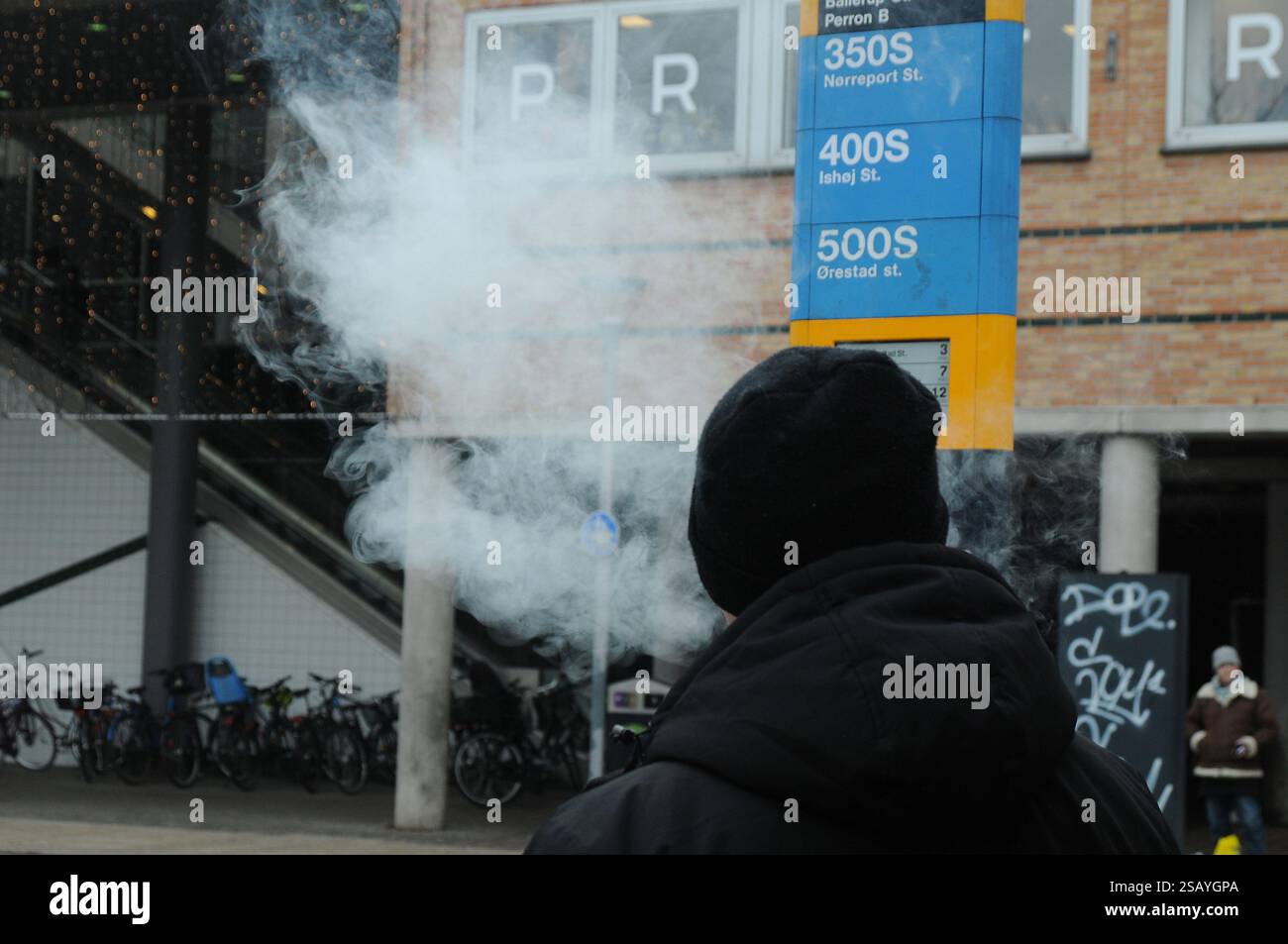 Copenhagen/ DenmarK/31 JANUARY 2025/ person smokes e-cigarette in ...