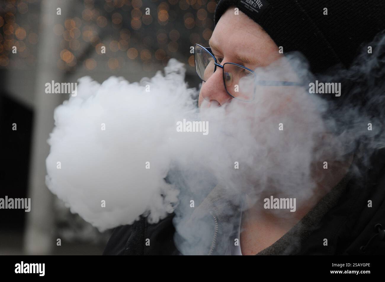 Copenhagen/ DenmarK/31 JANUARY 2025/ person smokes e-cigarette in ...