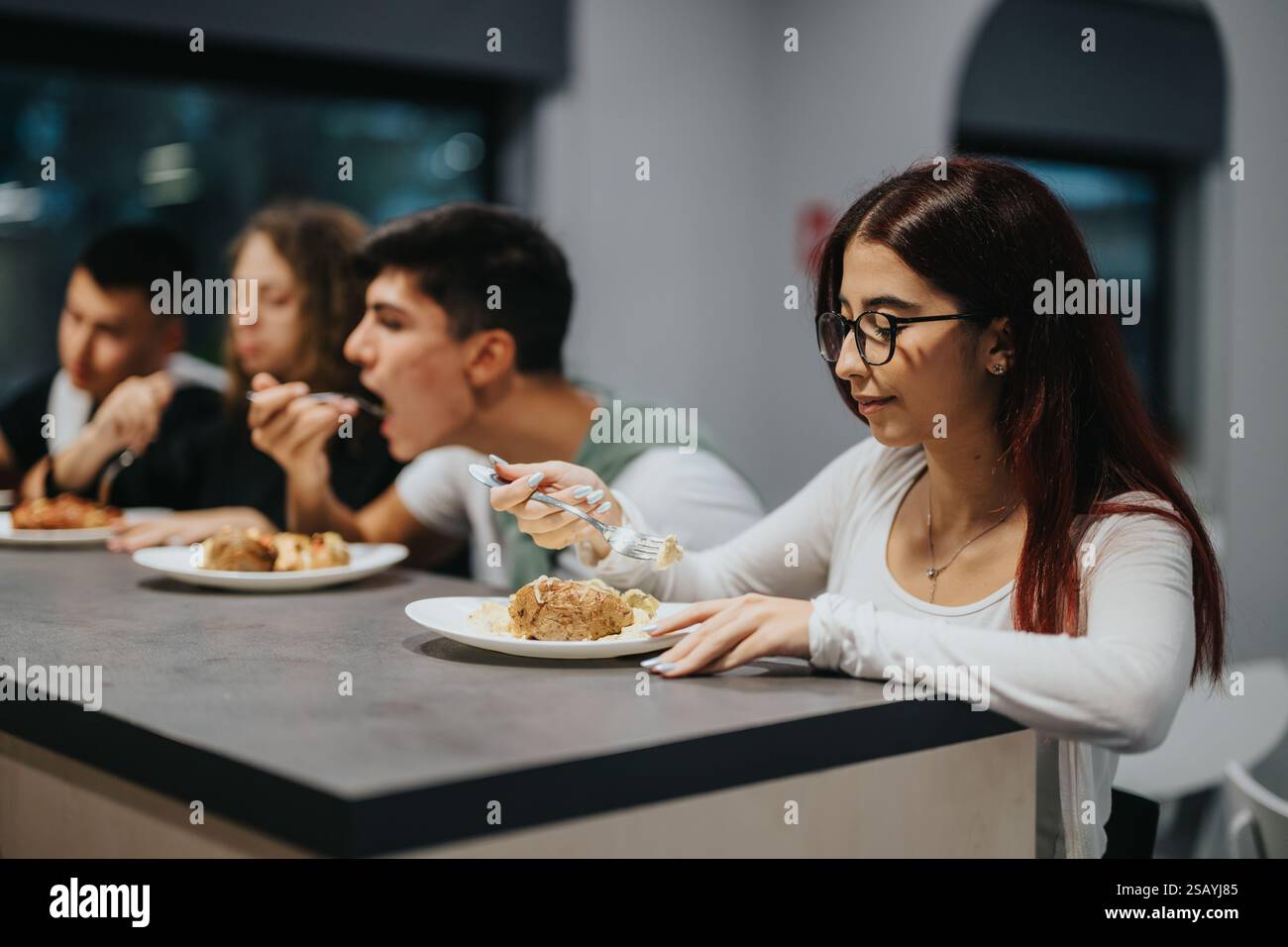 High school students enjoying lunch together in cafeteria setting Stock ...