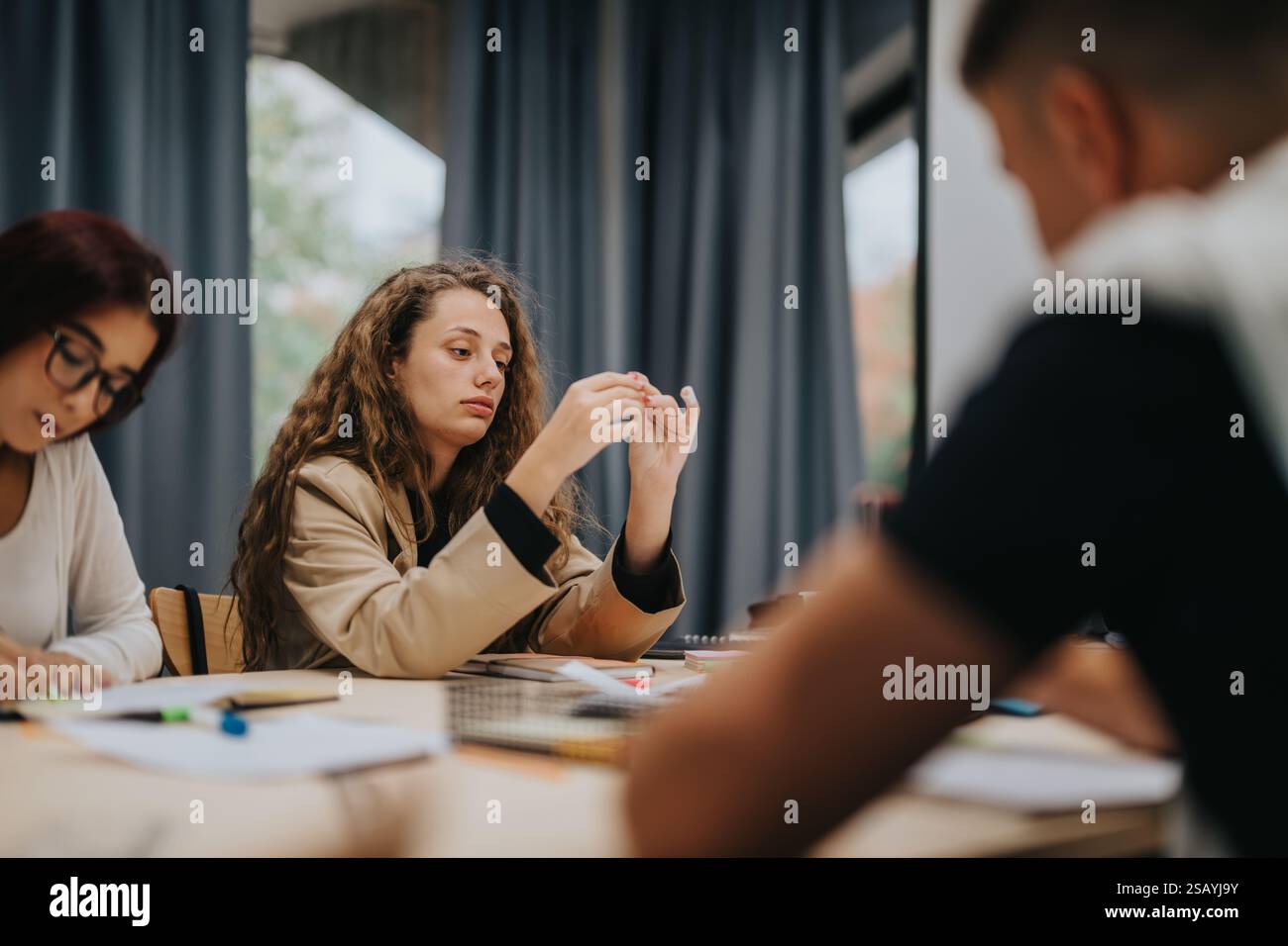 Group of students focused on classroom learning and discussion Stock ...
