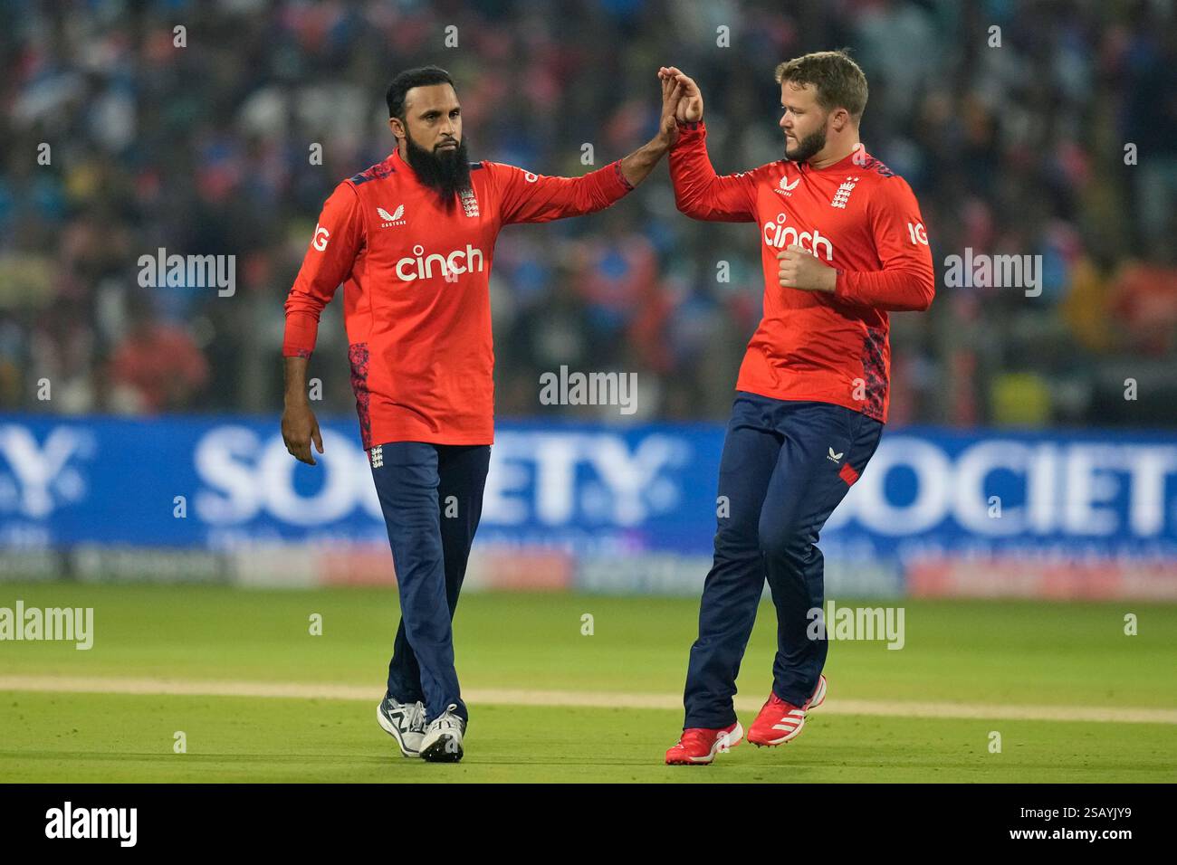 England's Adil Rashid, left, celebrates with teammate Ben Duckett the ...