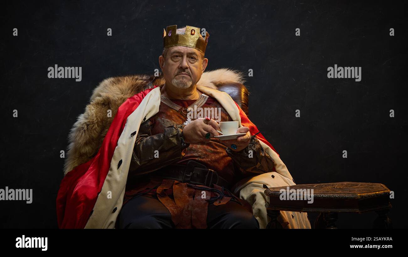 Portrait of powerful leader, medieval kind in crown sitting on throne ...