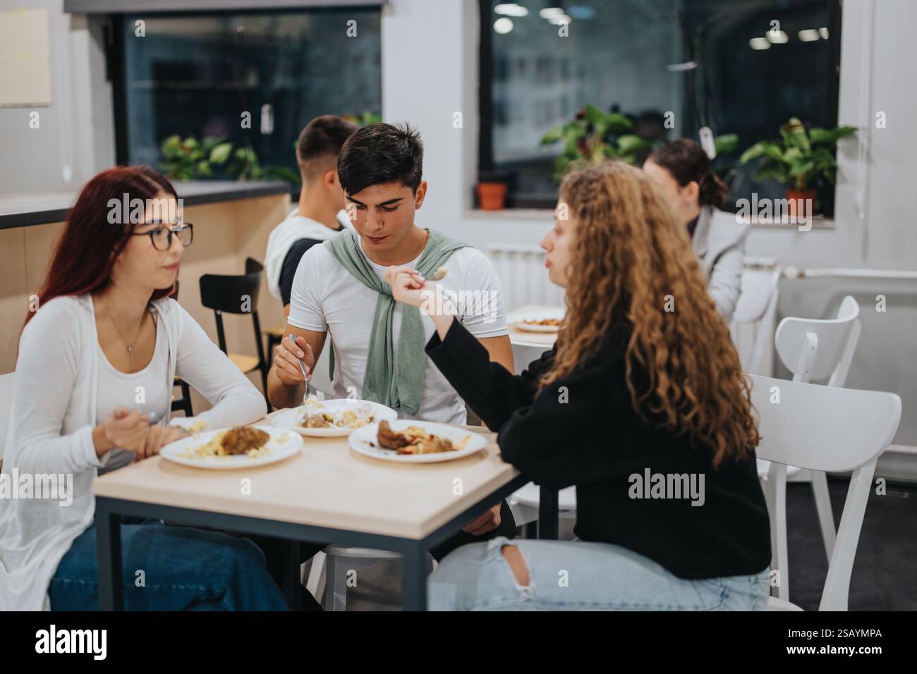 Young friends capturing moment camaraderie hi-res stock photography and ...