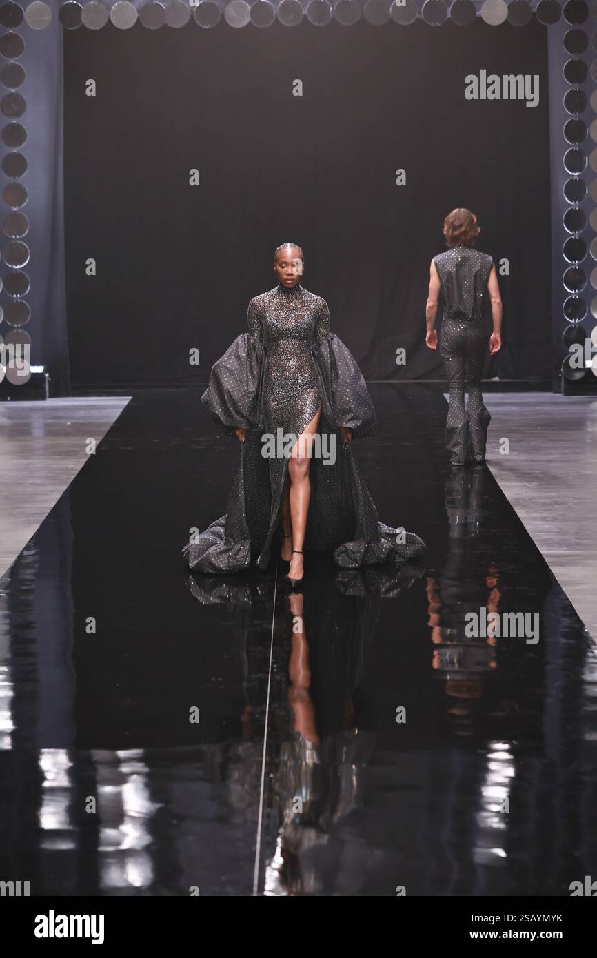 BERLIN, GERMANY - January 31: A model walks the runway during the ...