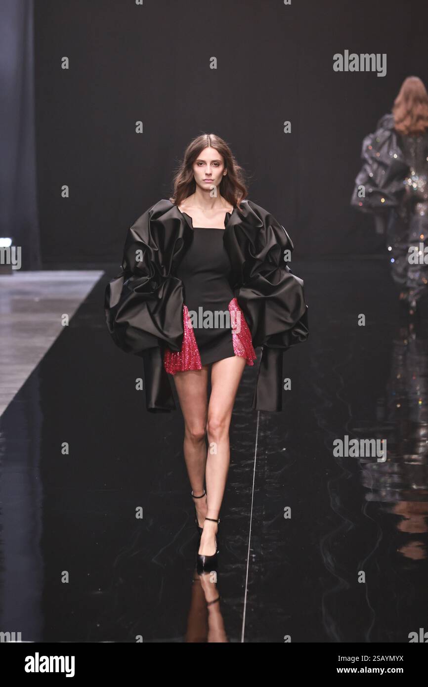 BERLIN, GERMANY - January 31: A model walks the runway during the ...