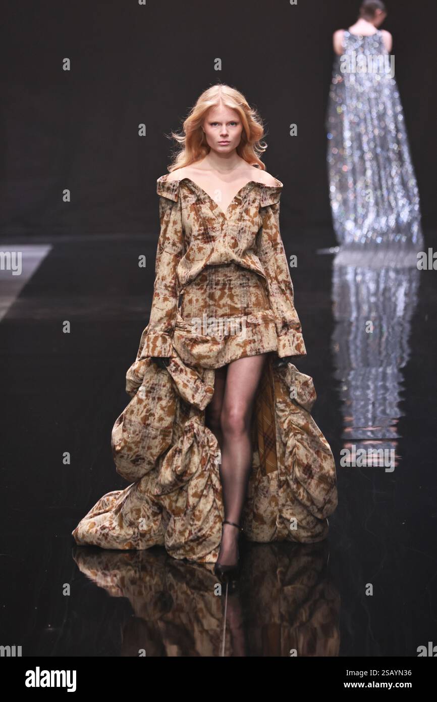 BERLIN, GERMANY - January 31: A model walks the runway during the ...