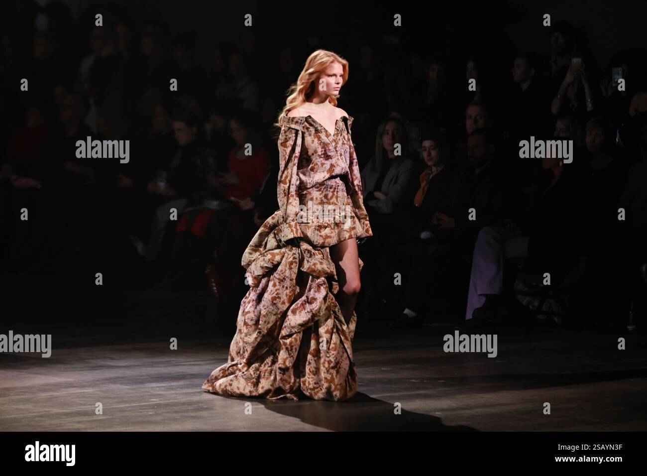 BERLIN, GERMANY - January 31: A model walks the runway during the ...