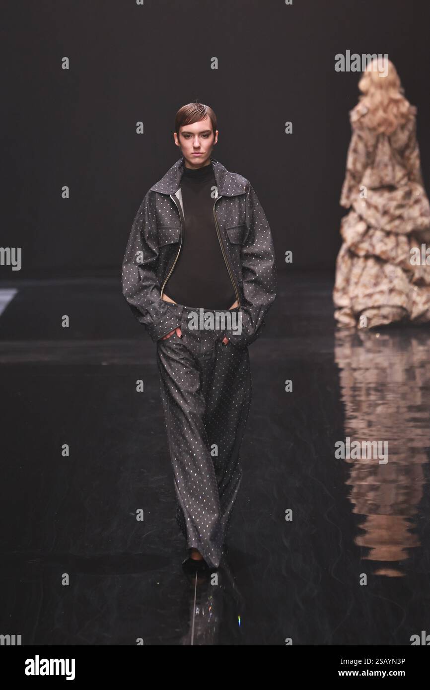 BERLIN, GERMANY - January 31: A model walks the runway during the ...