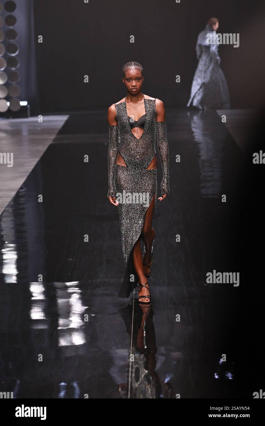 BERLIN, GERMANY - January 31: A model walks the runway during the ...