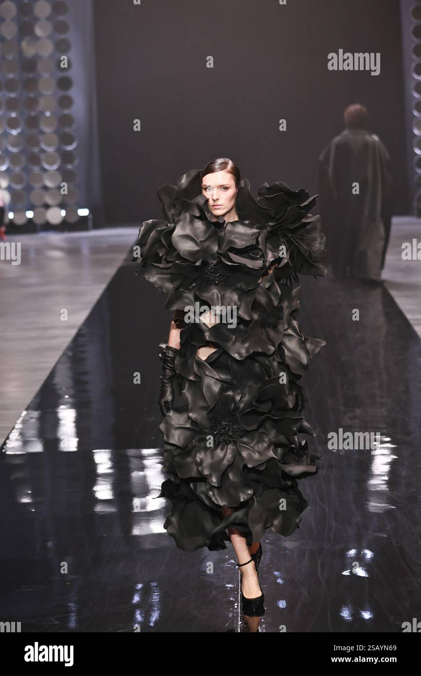 BERLIN, GERMANY - January 31: A model walks the runway during the ...