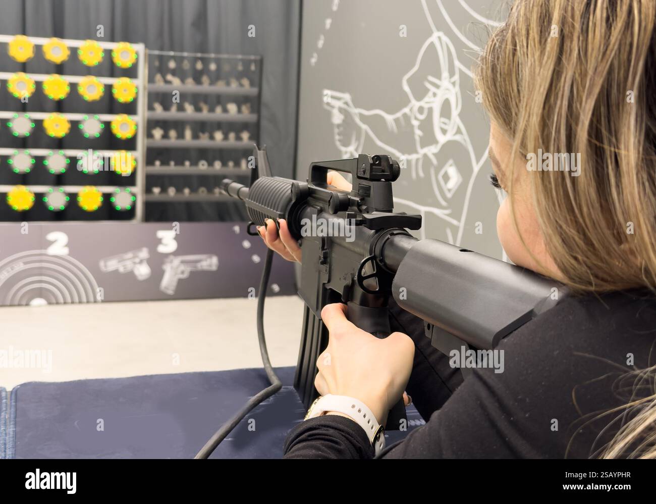 Shooters practicing tactical shooting in a modern indoor gun range ...