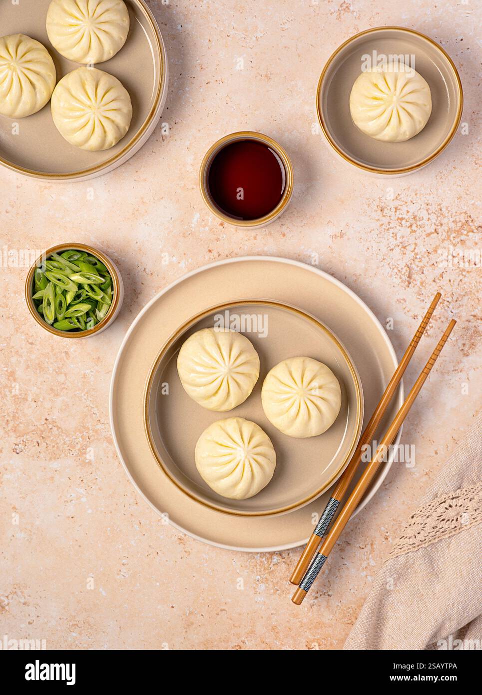 Food photography of steamed duck bao buns, spring onion, soy sauce ...