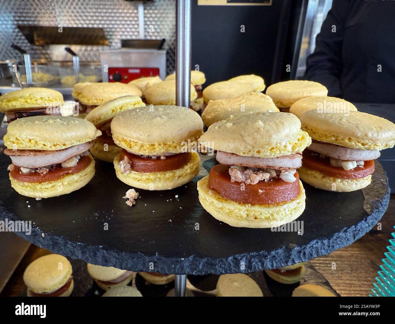 Neuwied, Germany. 31st Jan, 2025. Currywurst macarons stand on a tray ...