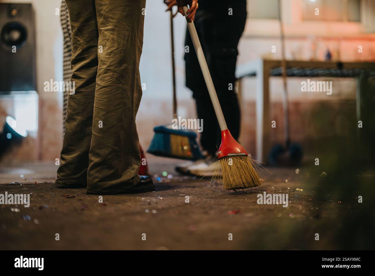 Close-Up of People Sweeping the Floor After a Celebratory Event Stock ...