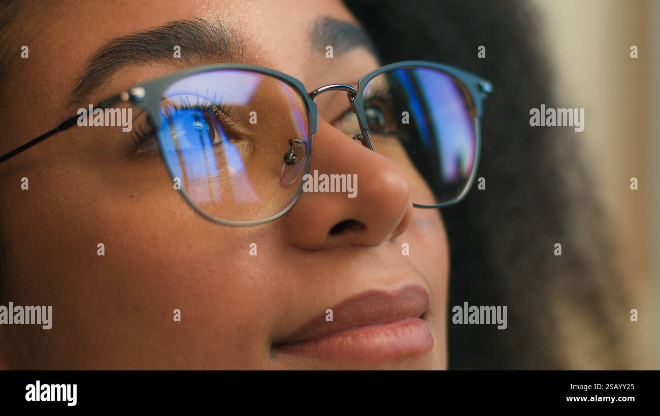 Close up female face woman African American girl in eyeglasses looking ...