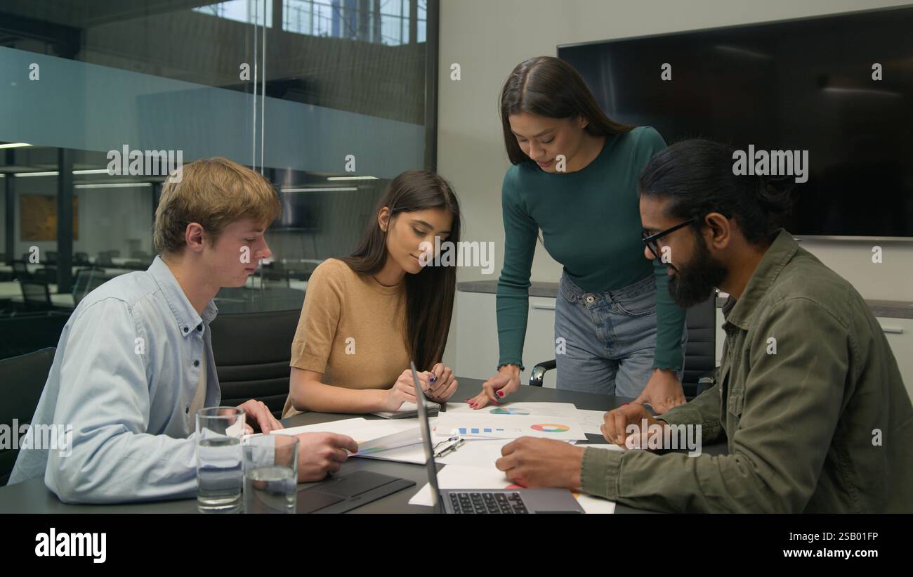 Team leader coworkers planning work analyzing corporate documents ...