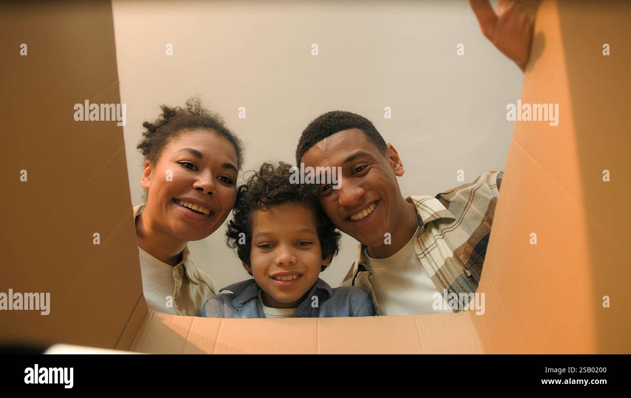 Point of view POV open box African american family parents son ...