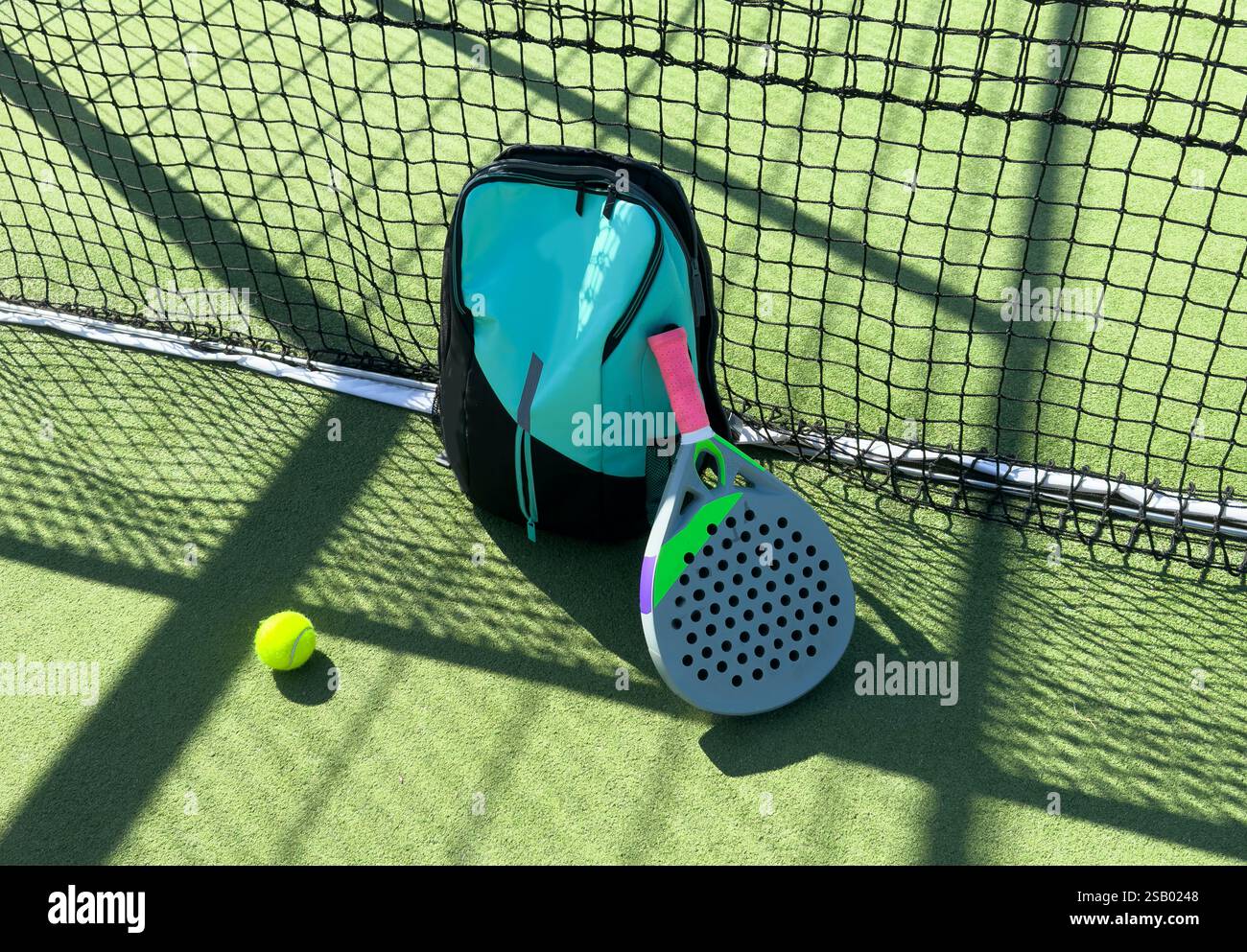 padel tennis racket and backpack in court Stock Photo - Alamy
