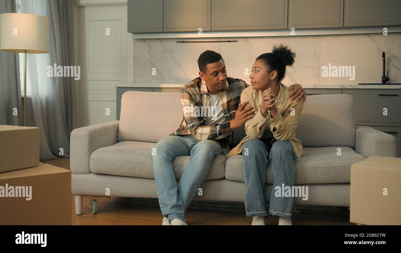 Upset African American married couple sad family renters home owners ...