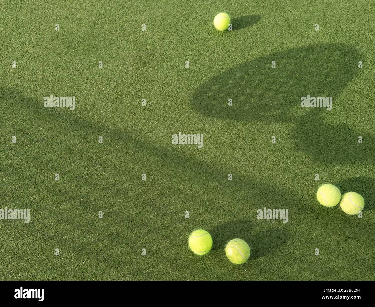 Paddle tennis racket shadow and ball on turf. Outdoors image with ...