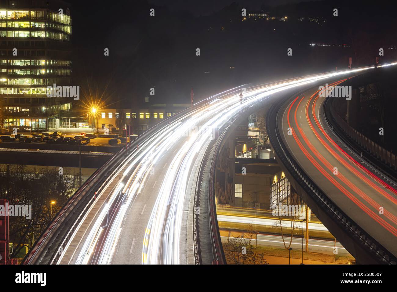 Federal road B14 at night, road bridge with traffic and light lanes. On ...