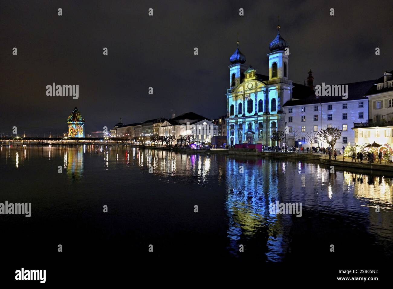 Water tower and Jesuit church on the right with light installation, on ...