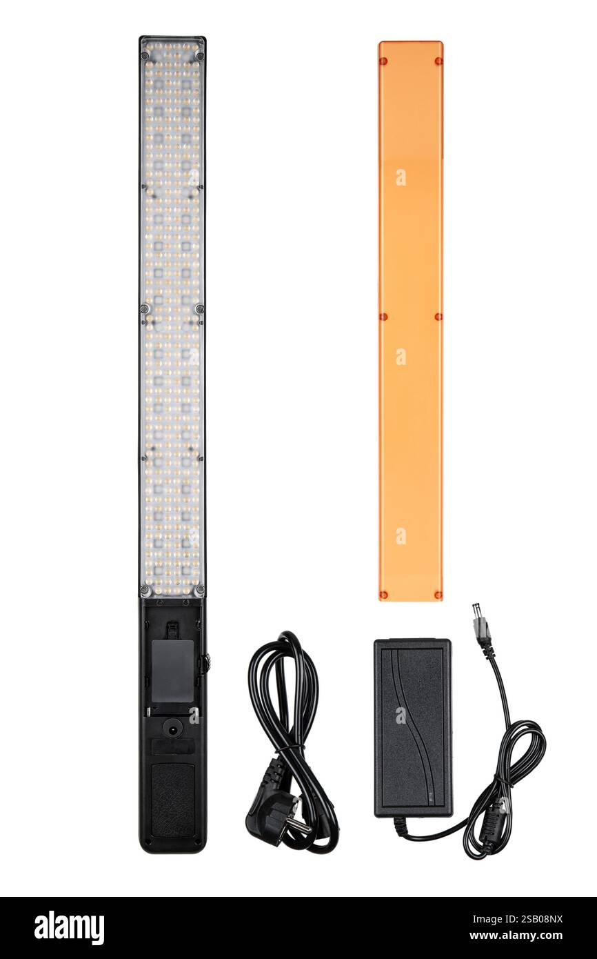 LED light panel with power adapter and orange filter, isolated on white ...