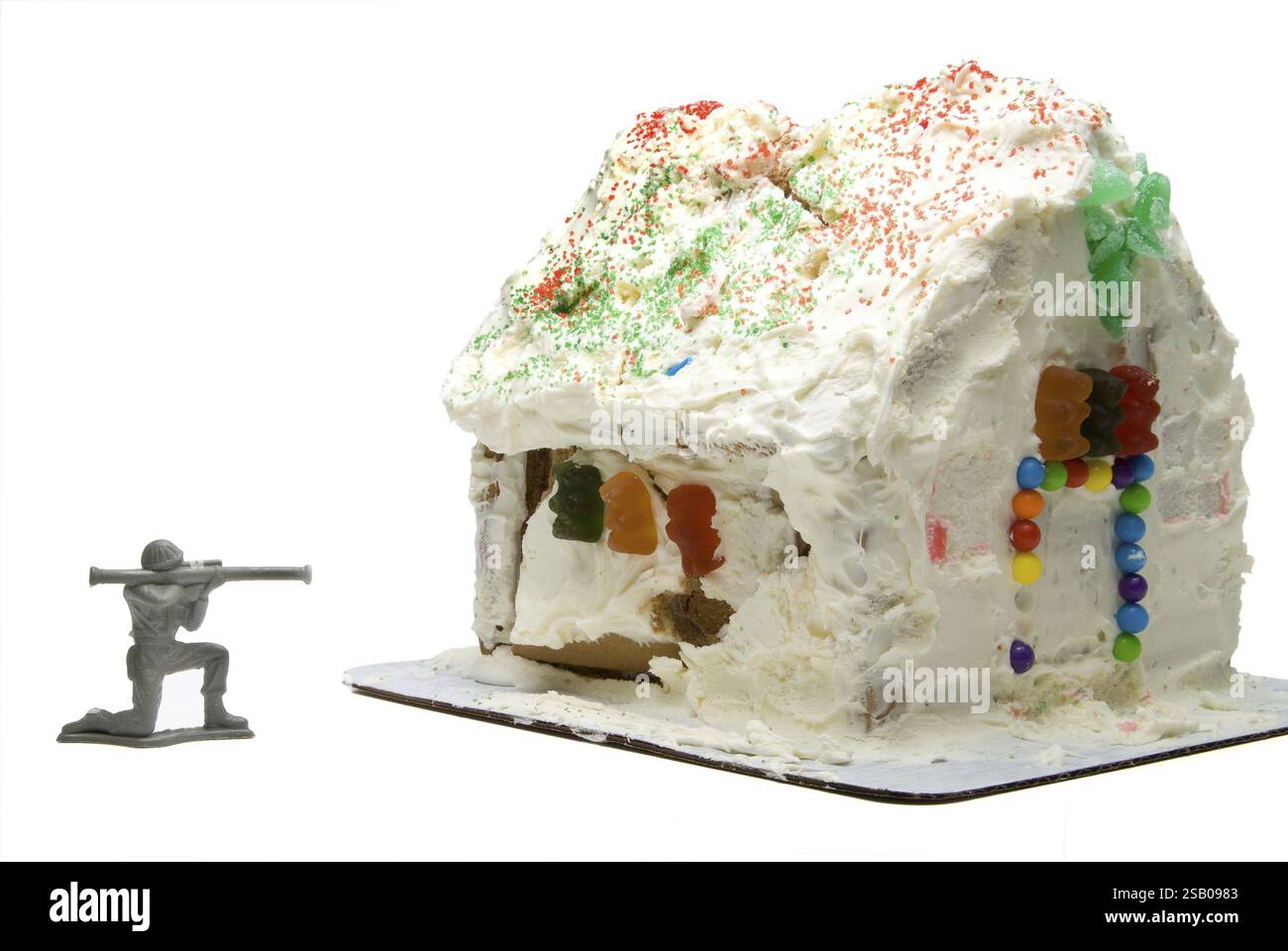 A gingerbread house under siege by a bazooka guy Stock Photo - Alamy