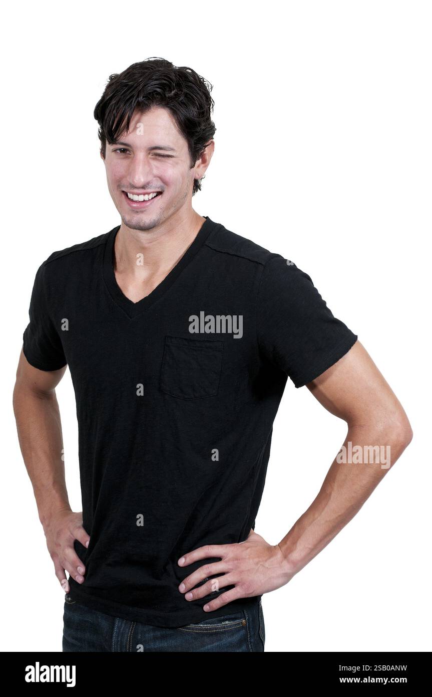 Flirting young handsome man winking and smiling Stock Photo - Alamy