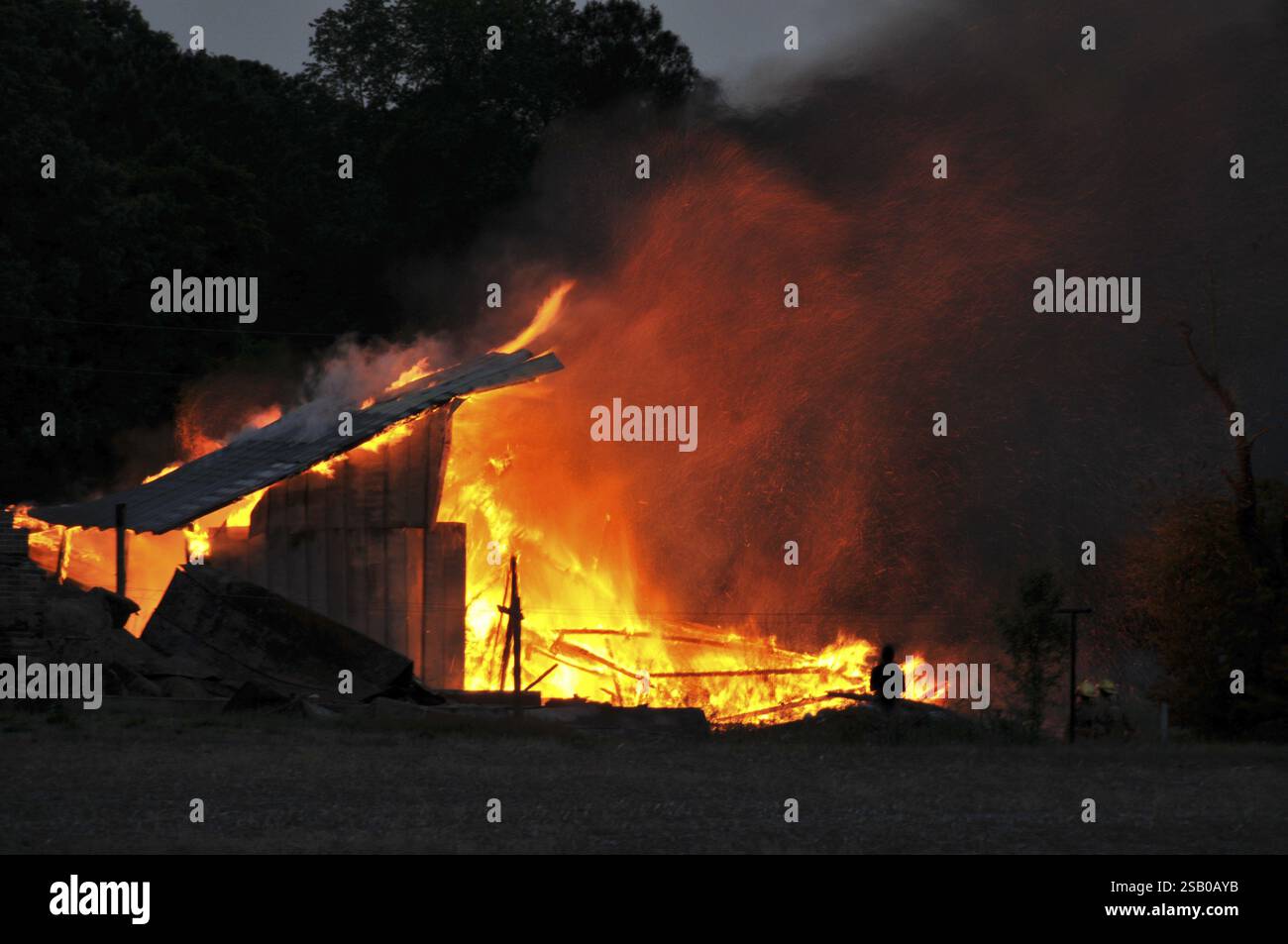 A building in the midst of being on fire Stock Photo - Alamy