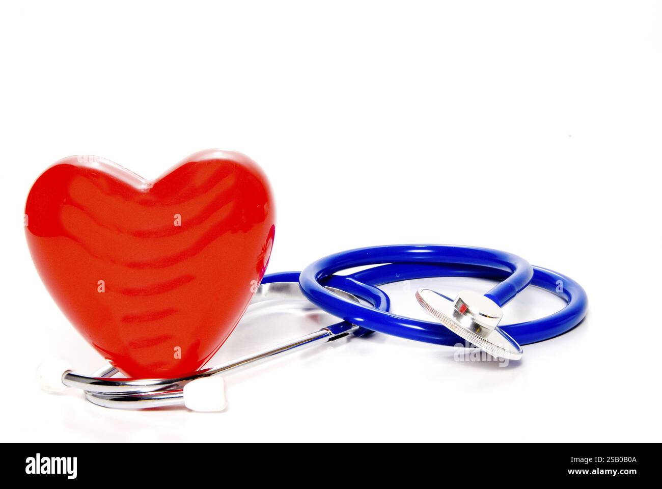 A red heart shape and a medical stethoscope Stock Photo - Alamy