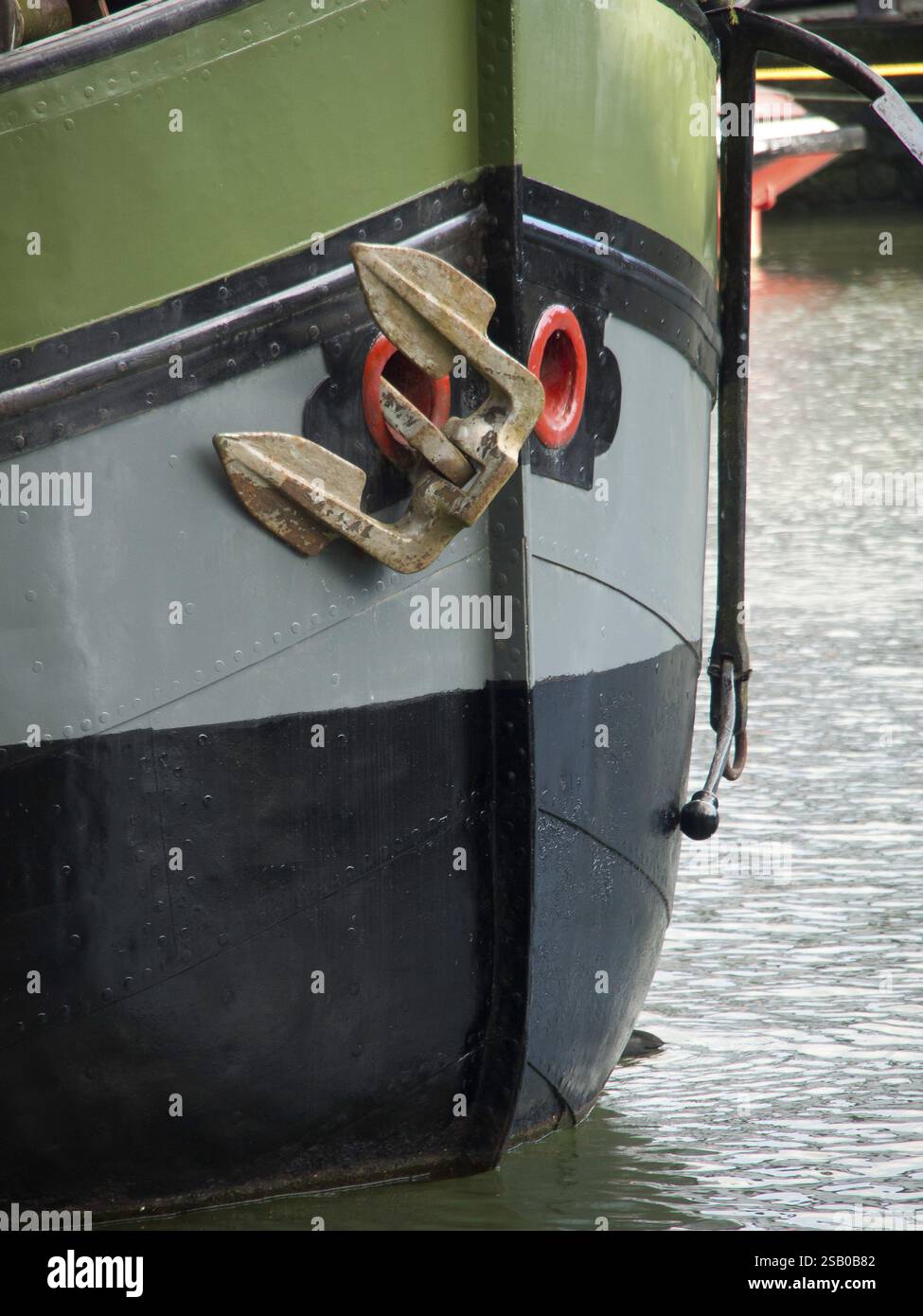 Front view of a ship's bottom with anchor on the water, Dordrecht. The ...