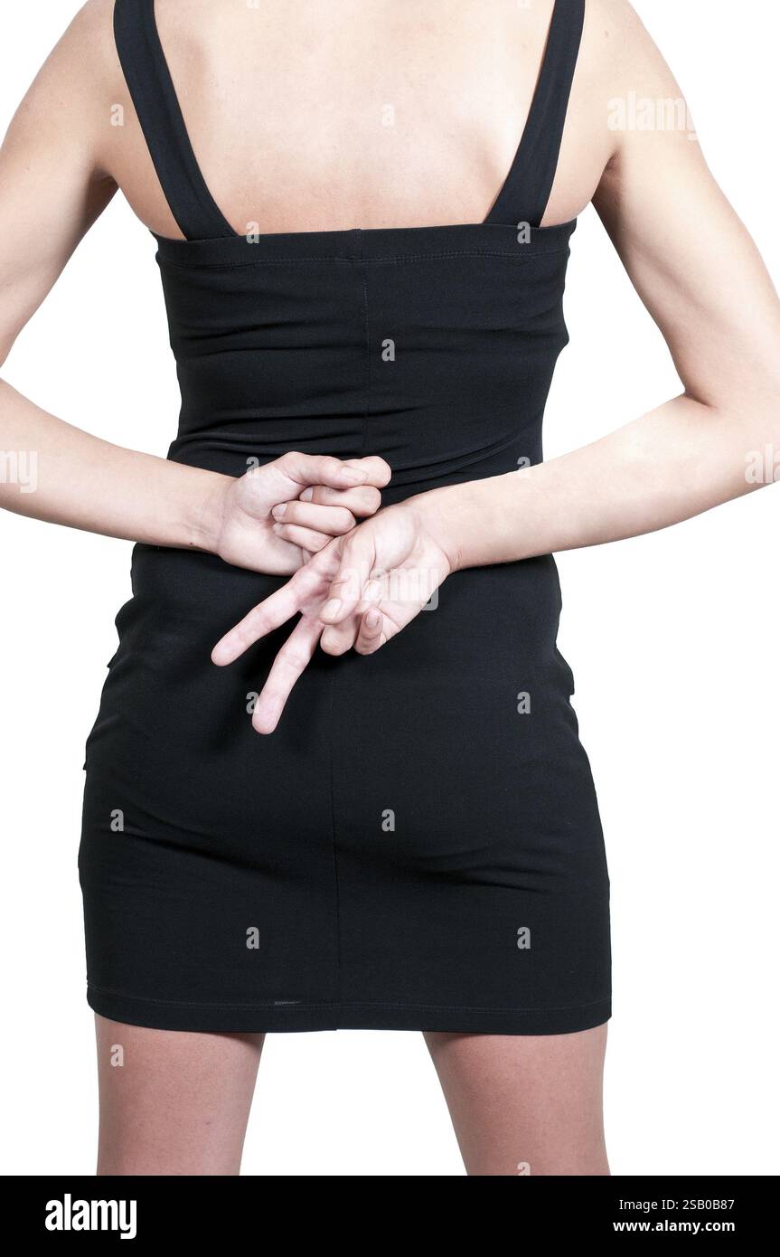 Woman holding her hands behind her back - pick a number between 1 and ...