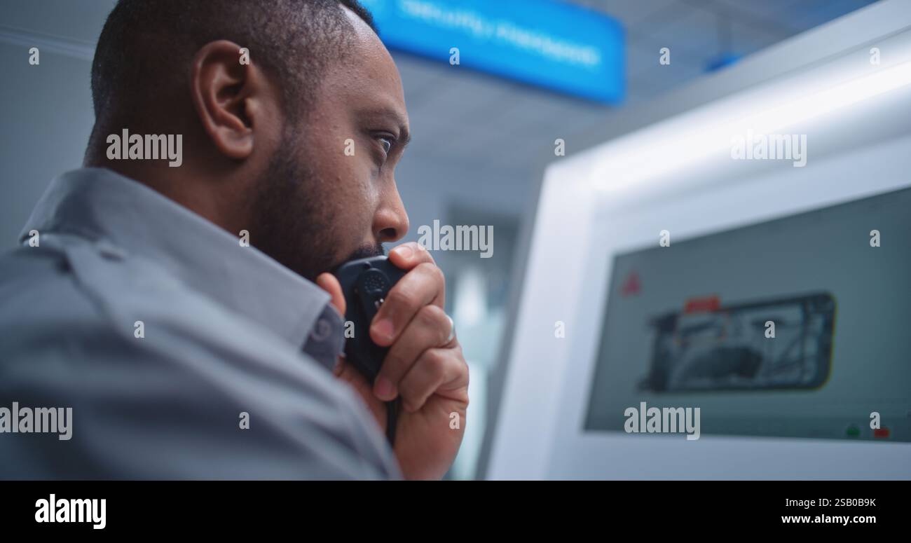 Airport Terminal: African American Security Officer Monitors X-ray ...