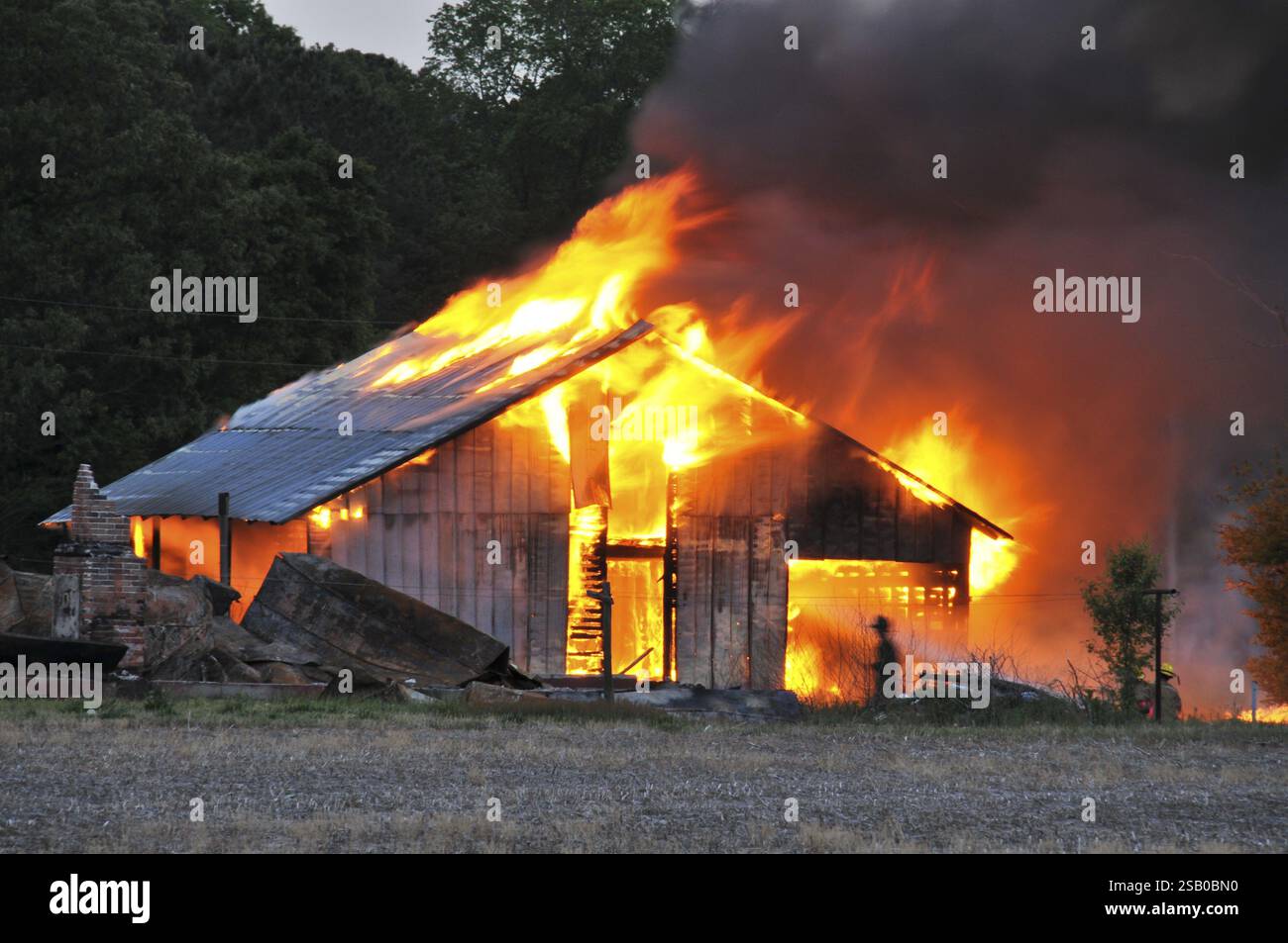 A building in the midst of being on fire Stock Photo - Alamy