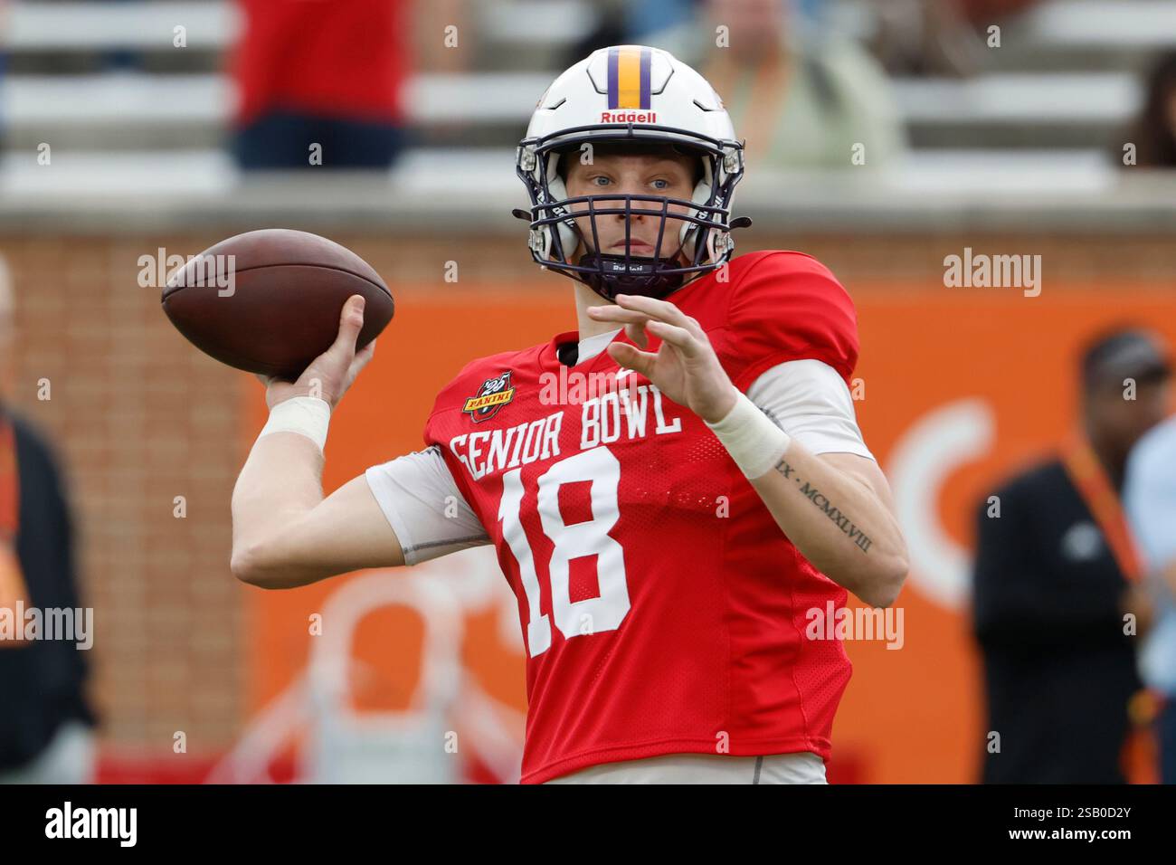 National team quarterback Taylor Elgersma of Laurier (18) runs through ...