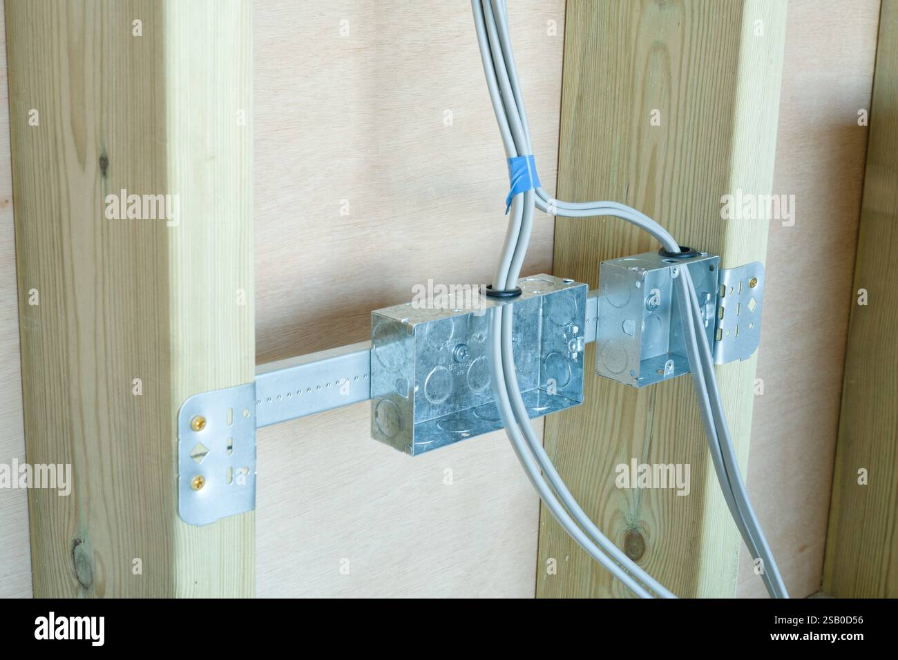 The first fix by electricians in wiring a property. New build wire installation to junction ...