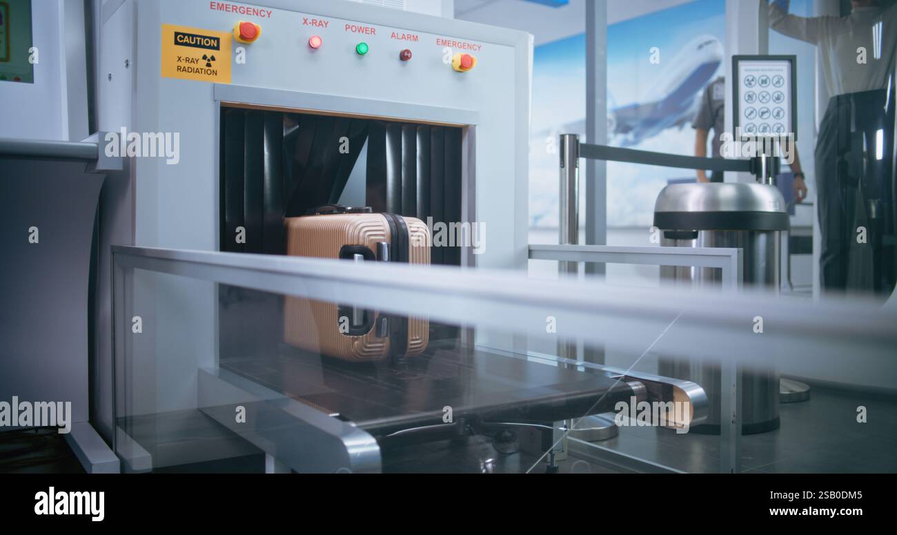 Security Checkpoint in Airport Terminal: Passenger Places Suitcase on ...