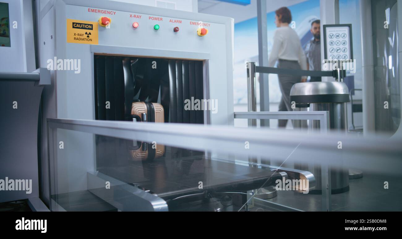 Security Checkpoint in Airport Terminal: Passenger Places Suitcase on ...