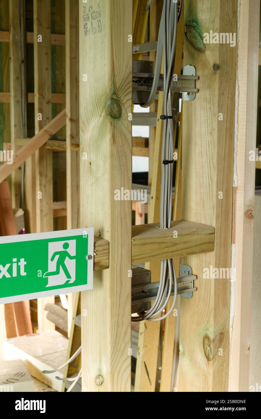 The first fix by electricians in wiring a property. New build wire installation to junction ...