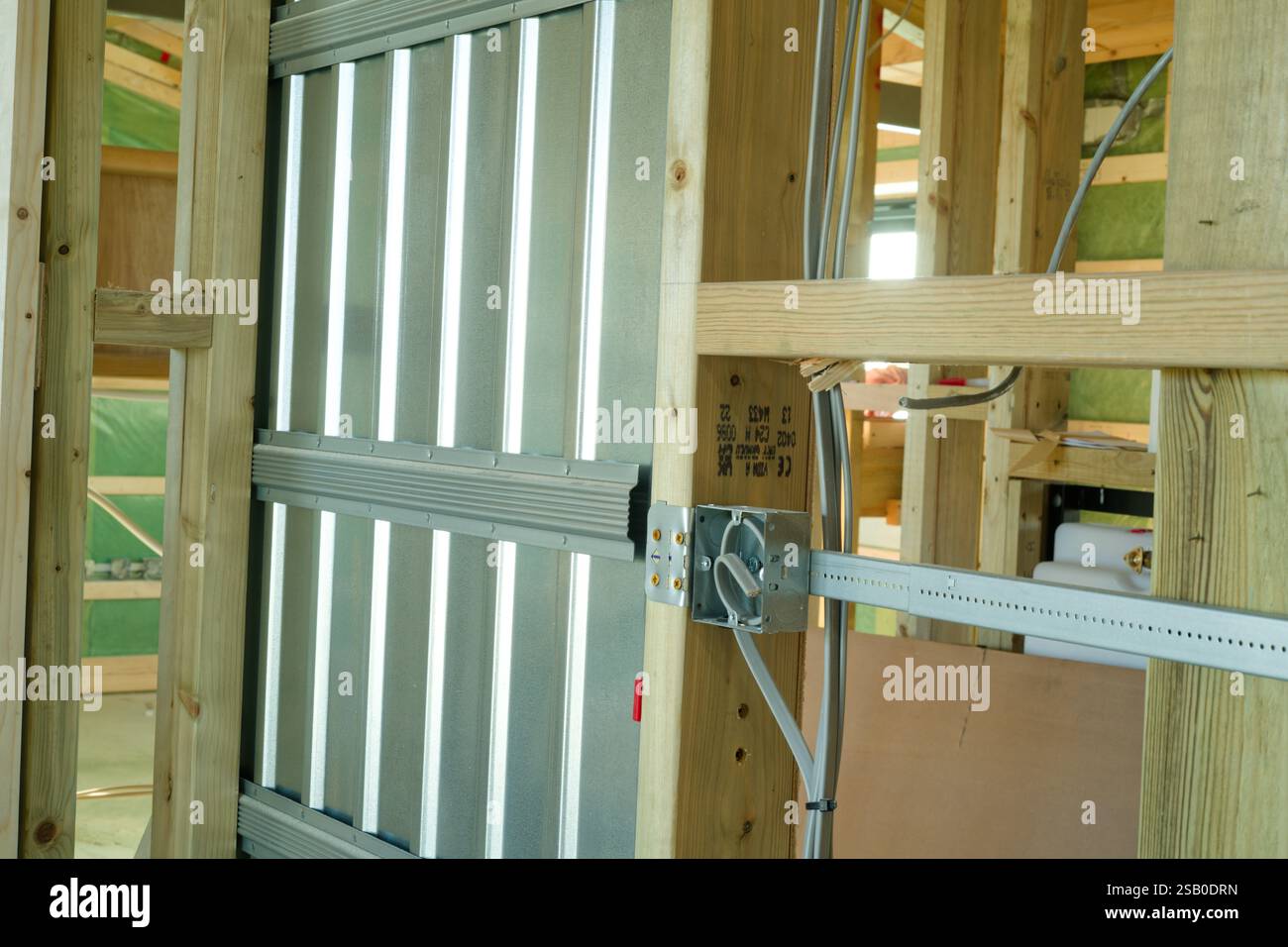 The first fix by electricians in wiring a property. New build wire installation to junction ...