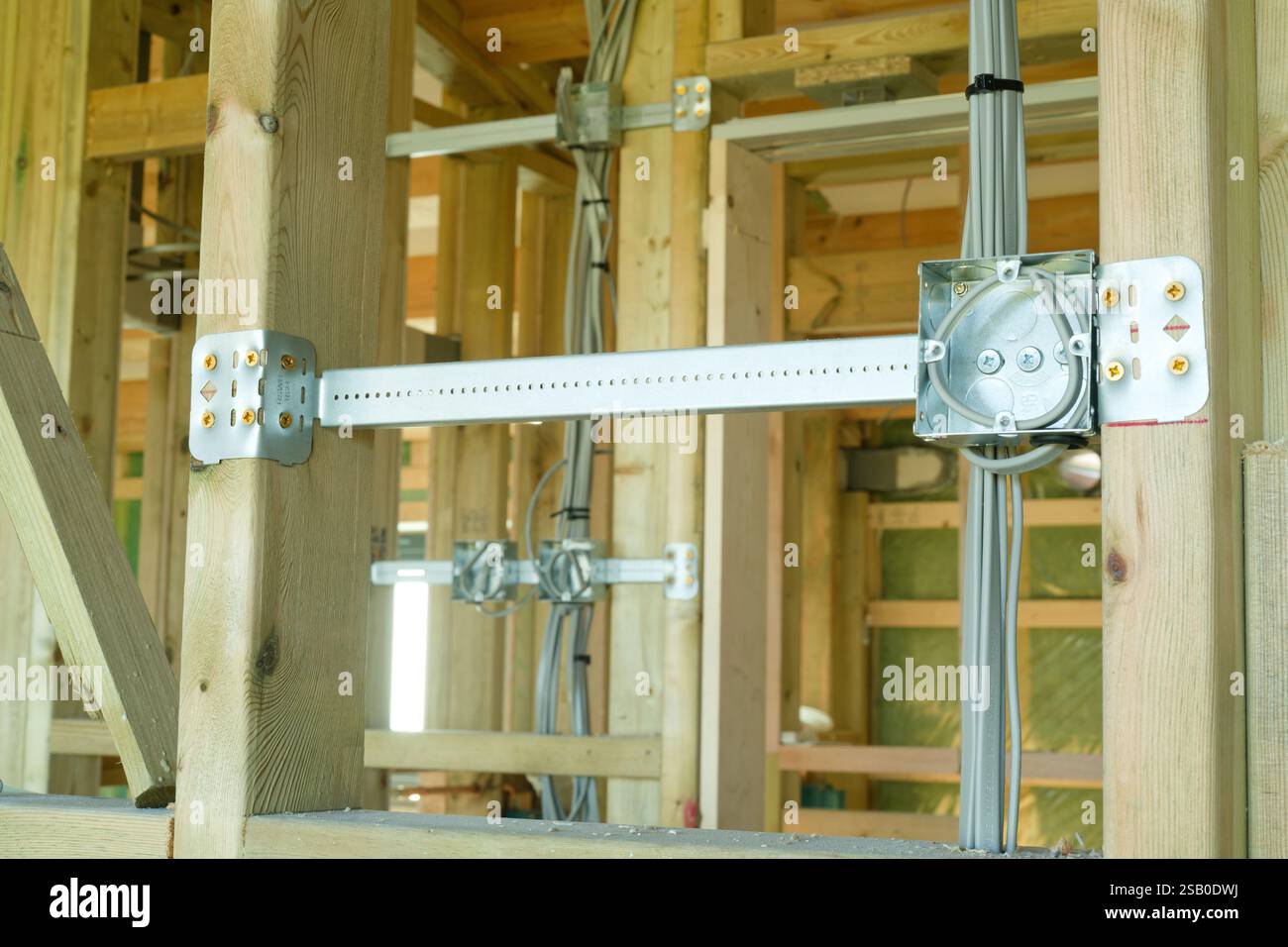 The first fix by electricians in wiring a property. New build wire installation to junction ...