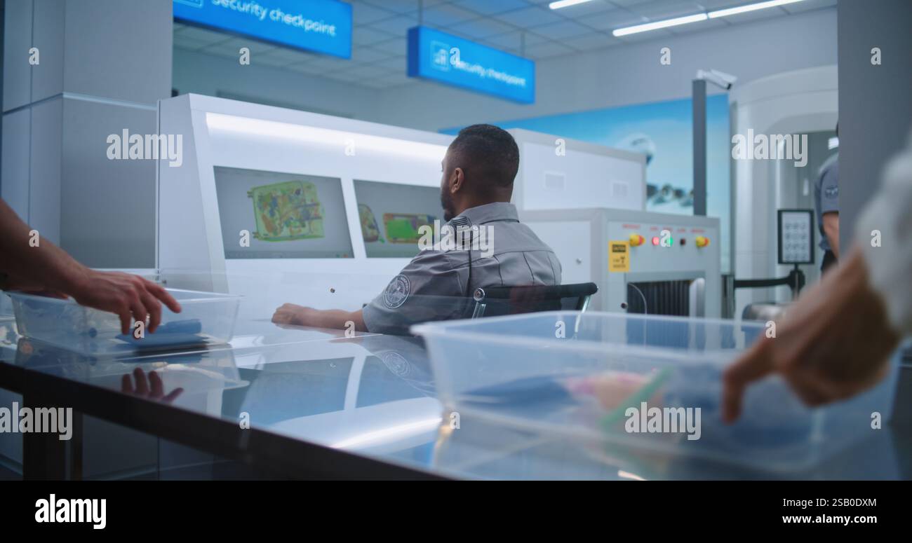 Airport Terminal: African American Security Officer Monitors Baggage ...