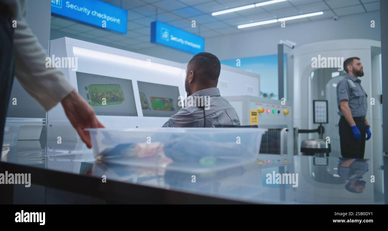 Airport Security Checkpoint: African American Security Officer Monitors ...