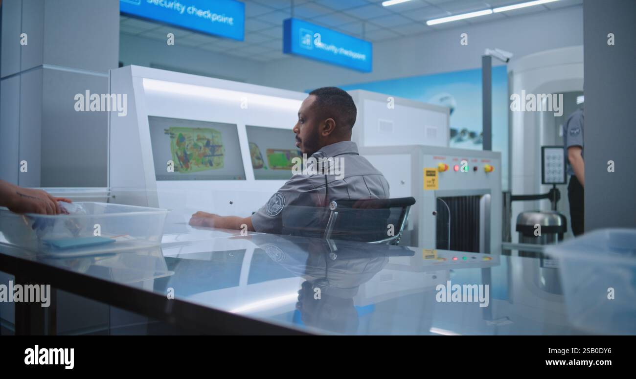 Airport Terminal: African American Security Officer Monitors Baggage ...
