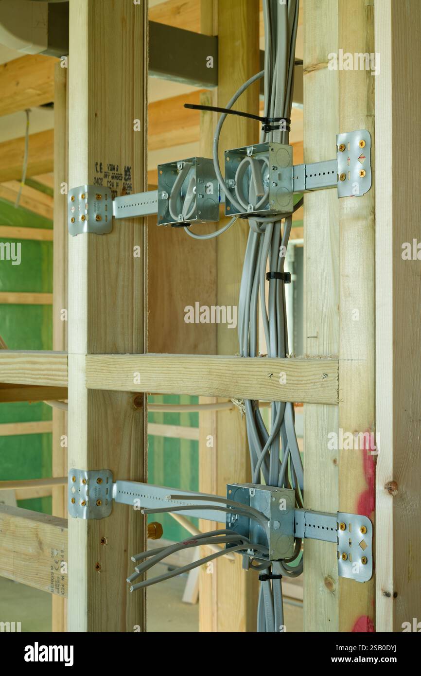The first fix by electricians in wiring a property. New build wire installation to junction ...